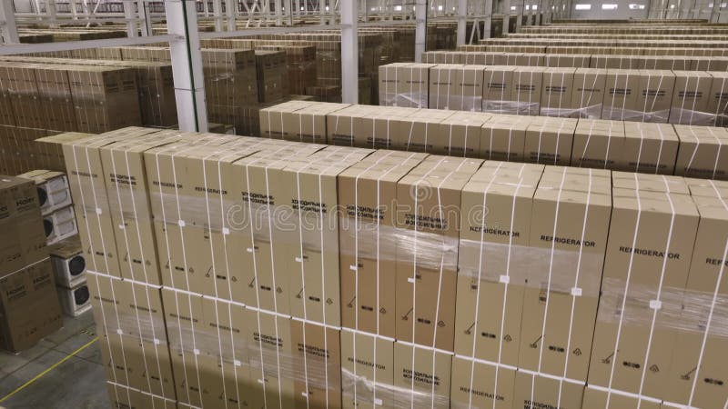 Refrigerators Rows in Cardboard Boxes in Lit Storage Stock Video ...