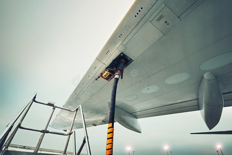 The Process Of Refueling Airplane In Airport. Fuel Hose Is Inserted ...