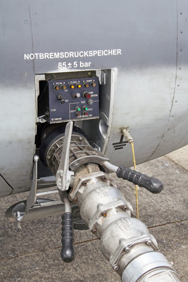 Refueling the Gas Tank with a Gun. Refueling a Gray Car at a Gas ...