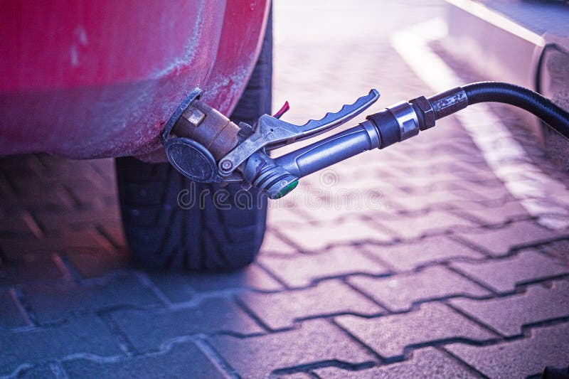 Refueling a Car at a Gas Station at Sunset Stock Photo - Image of ...