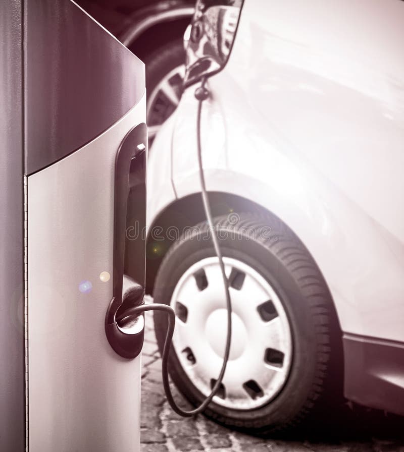 Refueling Gun at Electric Vehicle Charging Station Stock Image - Image ...
