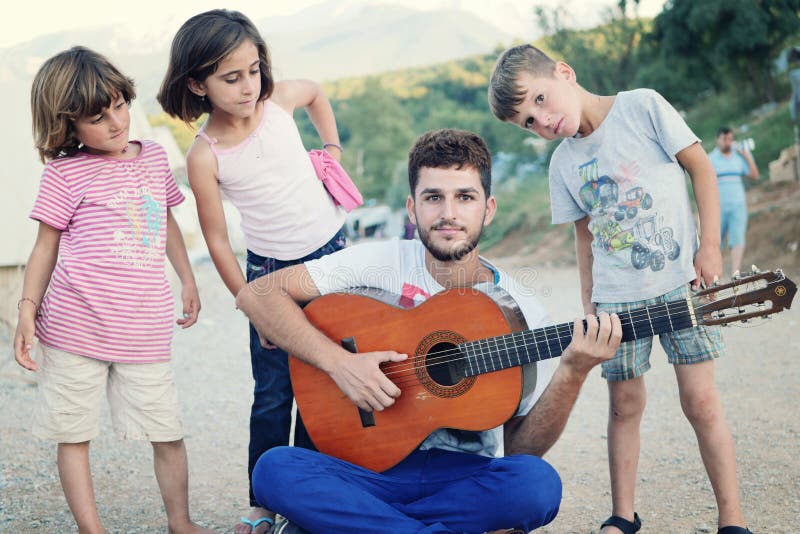 Refugee group singing editorial stock image. Image of friendship - 76832294
