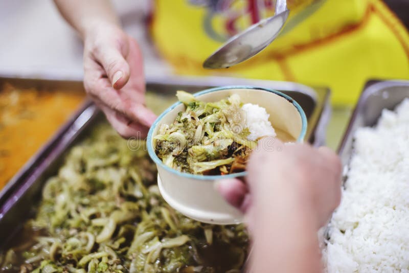 Refugees` Hands are Receiving Food from Philanthropists: the Concept of ...