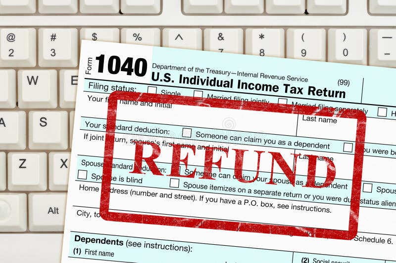 Refund Message with US Federal 1040 Tax Return Form on a Keyboard ...