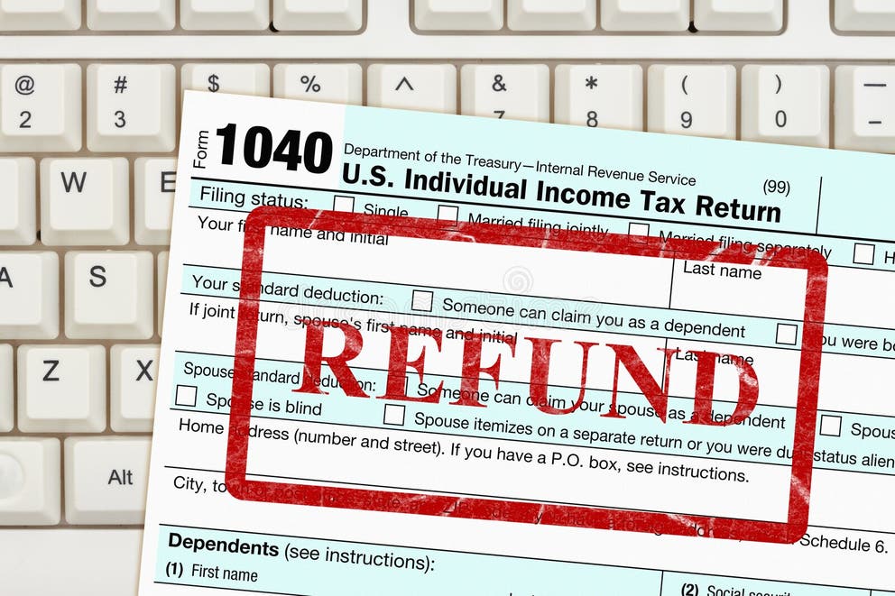 Refund Message with US Federal 1040 Tax Return Form on a Keyboard ...