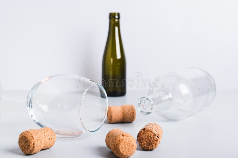 Refusal of Alcohol, Wine Glass and Empty Bottles Lie among Corks on the ...