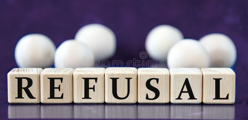 REFUSAL - Word on Wooden Cubes on a Blue Background with Wooden Balls ...