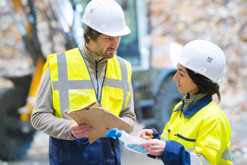 Refuse Site Workers Holding Carboard and Plastic Spray Bottle Stock ...