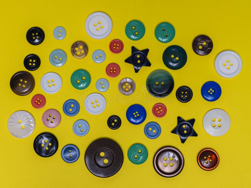 Regular Buttons of Various Sizes Stock Photo - Image of buttonhole ...