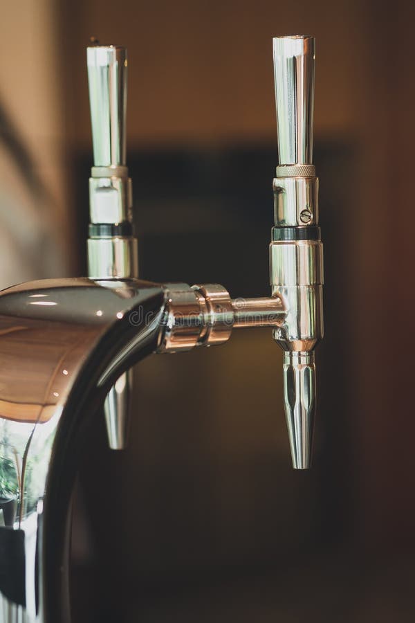 The beer taps in a pub stock photo. Image of liquid - 244118132
