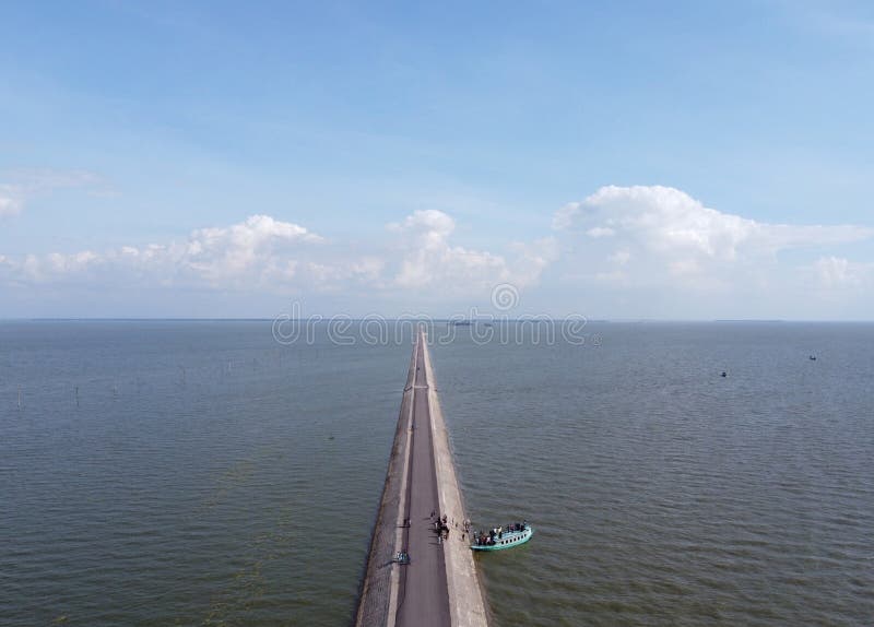 A Long Rectangular Road with People on it. or a Long Road Leading To a ...