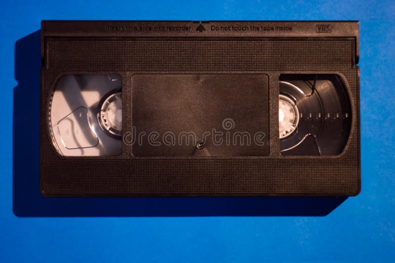 Regular VHS Tape on a Blue Background in the Center of the Frame Stock ...
