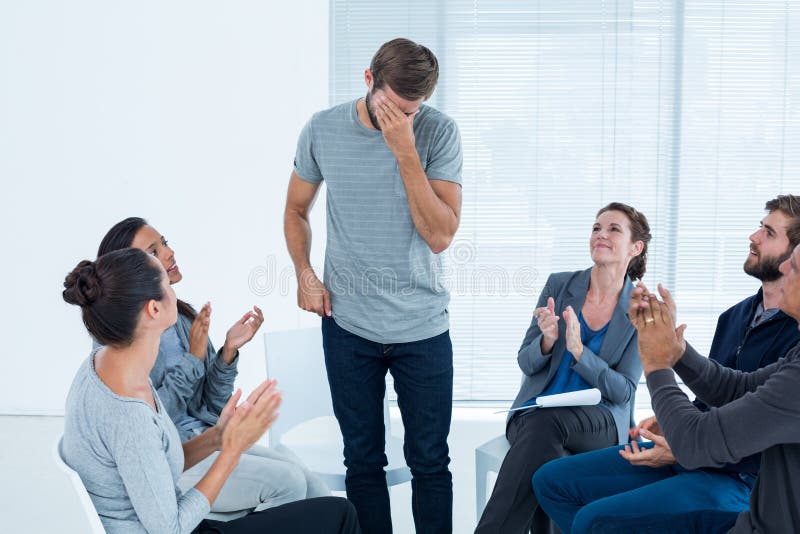 Rehab Group Applauding Delighted Man Standing Up Stock Photo - Image of ...