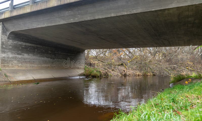 Reinforced Concrete Bridge Over the River, View from Below Stock Image ...