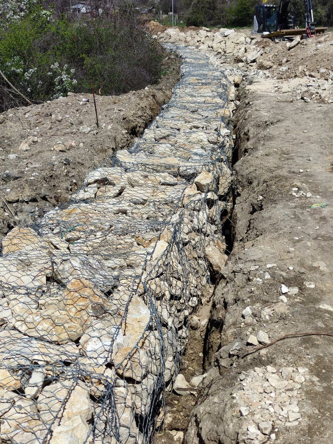 Reinforcing the Road with Stones in a Metal Mesh Stock Image - Image of ...