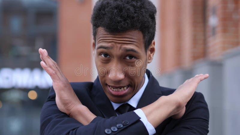 Rejecting, Disliking Gesture by African Businessman Stock Photo - Image ...