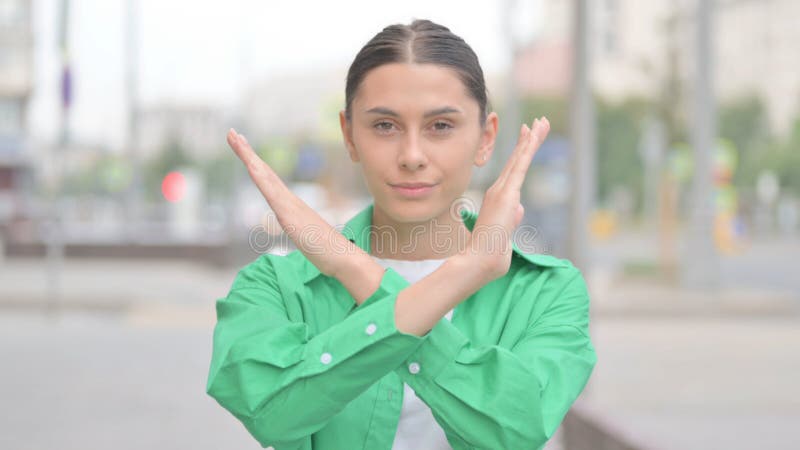 Rejecting Hispanic Woman with Disliking Gesture Outdoor Stock Image ...