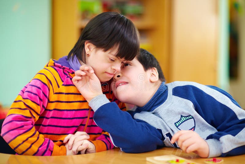 Relations between Kids with Disabilities Stock Photo - Image of embrace ...
