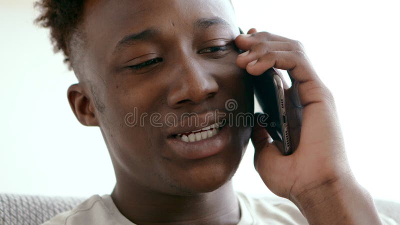 Sad Black Guy Talking with Girlfriend by Mobile Phone, Close Up Stock ...