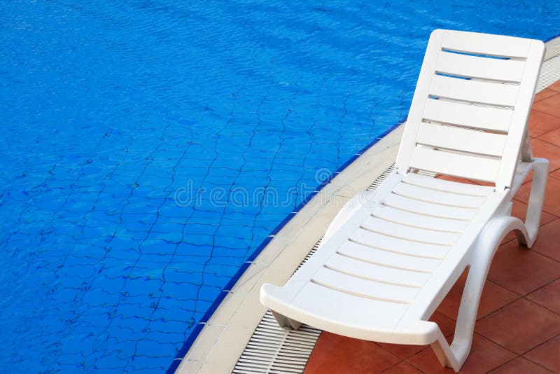 Relax chair near the pool stock photo. Image of outdoors - 11521022