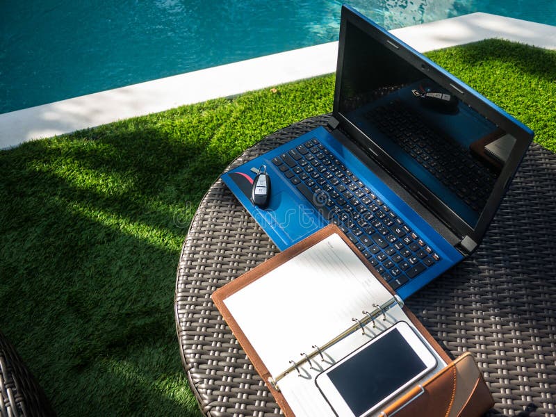 Relax Time Working Area Near Pool with Laptop, Notebook and Phone Stock ...