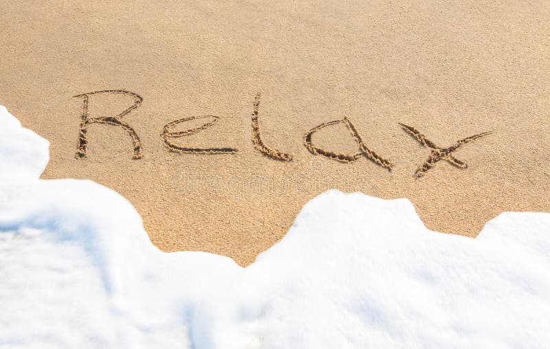 Relax - Written in the Sand Stock Image - Image of wave, sand: 27385617