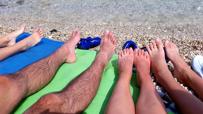 Relaxation on the beach stock photo. Image of family - 186805708