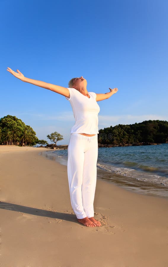 Relaxation Exercise on Beach Stock Image - Image of human, model: 13687429