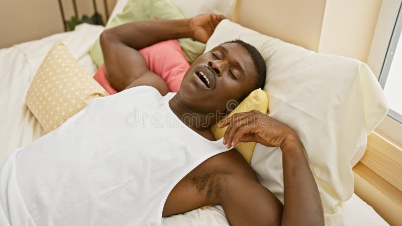 Relaxed African Man Sleeping Contentedly in His Sunny Bedroom Stock ...