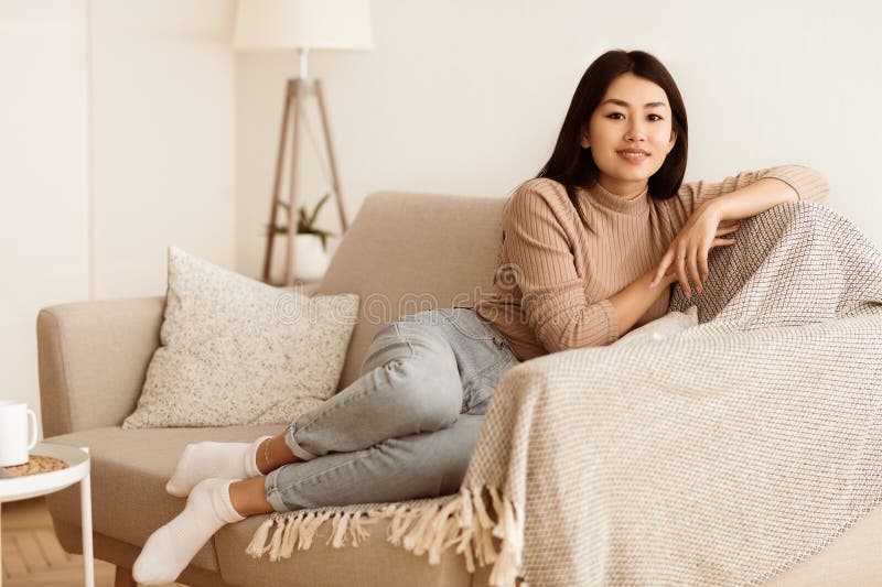 Relaxed Asian Girl Enjoying Rest on Comfortable Sofa Stock Image ...