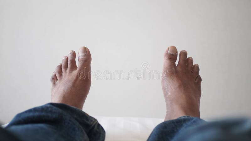 Relaxed Bare Feet on a Plain White Background in a Closeup Perspective ...