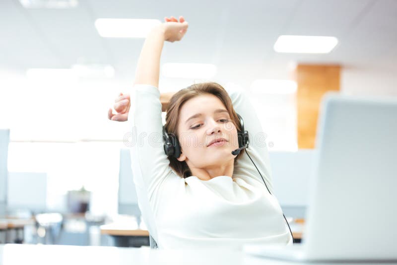 Relaxed Beautiful Woman Sitting and Stretching on Workplace Stock Photo ...