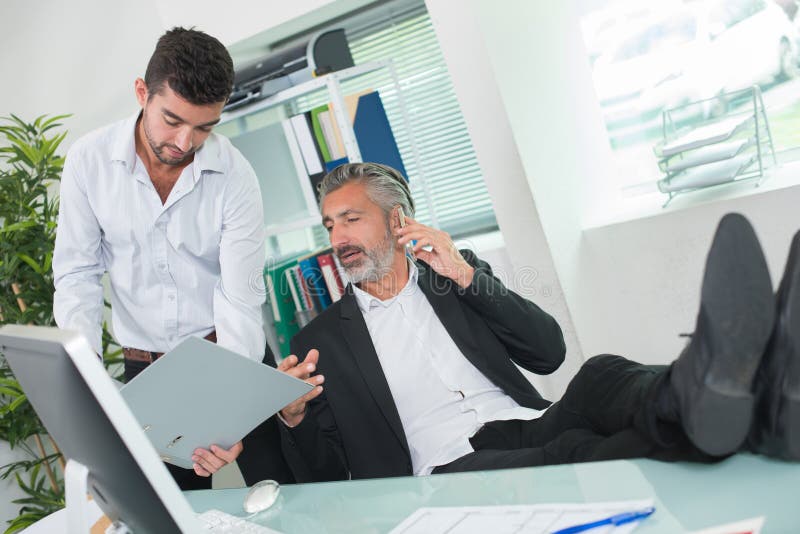 Relaxed Boss and Assistant in Office Stock Image - Image of indoors ...