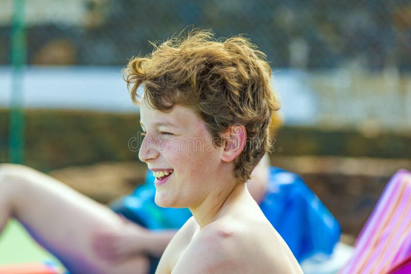 Relaxed Boy Enjoys Lying on a Beach Lounger Stock Photo - Image of ...