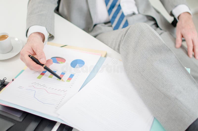 Relaxed Businessman Checking Financial Graphs Stock Image - Image of ...