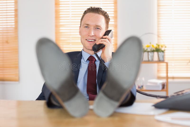 Relaxed Businessman Making a Phone Call Stock Photo - Image of phoning ...