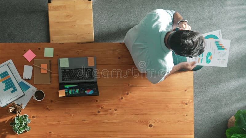 Relaxed Businessman Talking Phone with Team while Sitting on Table ...