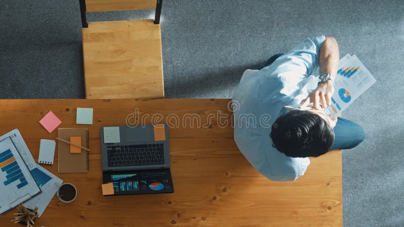 Relaxed Businessman Talking Phone with Team while Sitting on Table ...