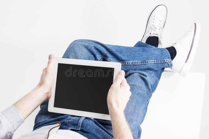Relaxed Caucasian Man Working with Tablet Computer while Lying on Floor ...