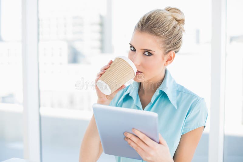 Relaxed Classy Woman Using Tablet while Drinking Coffee Stock Photo ...