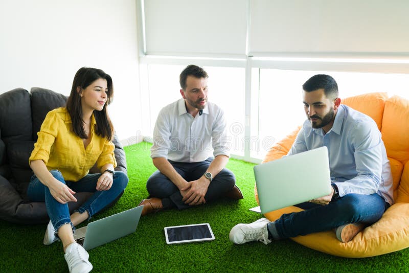 Relaxed Colleagues Doing a Work Project Stock Photo - Image of relaxed ...