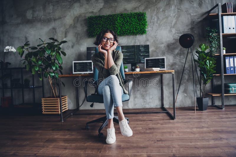 Casual Professional Woman Working Remotely in a Modern Workspace with ...