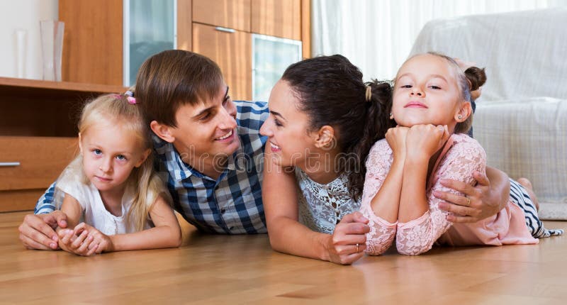 Relaxed Family in Domestic Interior Stock Photo - Image of spouses ...