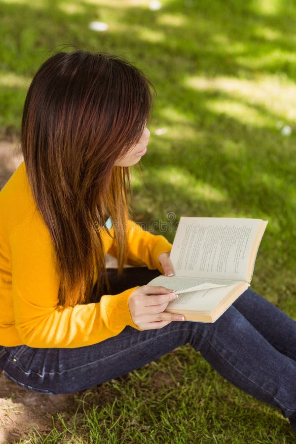 Relaxed Female Student Reading Book in Park Stock Photo - Image of ...