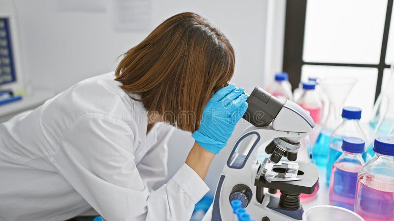 Relaxed yet Focused, a Young, Beautiful Hispanic Woman Scientist ...