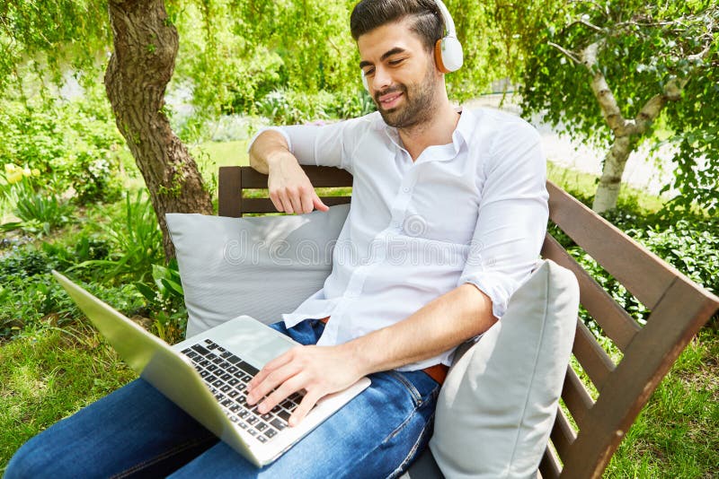 Relaxed Freelancer on the Laptop Computer Stock Photo - Image of chat ...