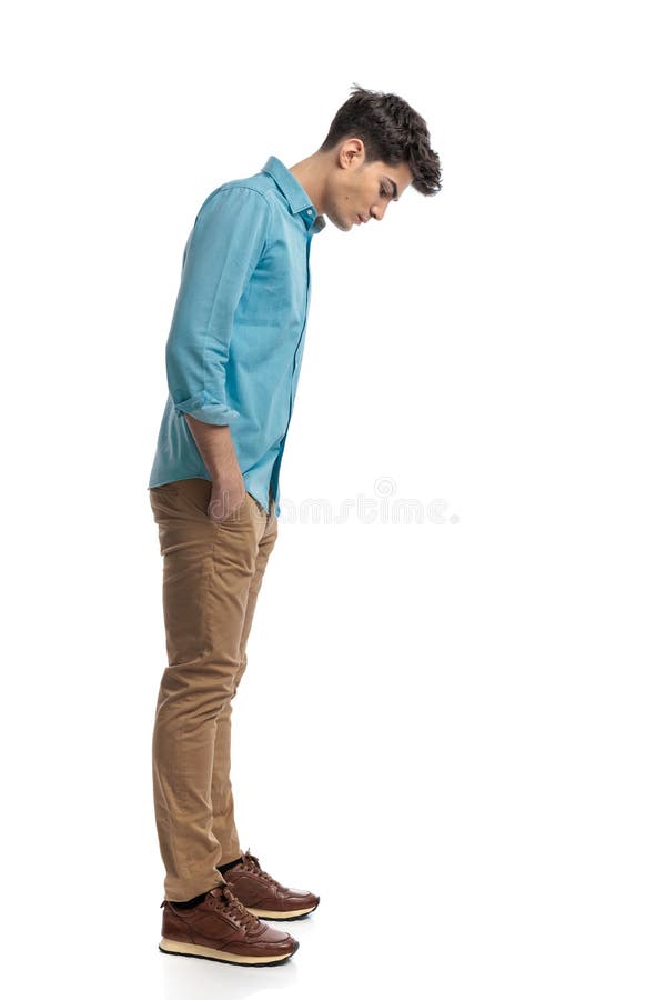 Relaxed Handsome Man Looking Down while Waiting in Line Stock Image ...