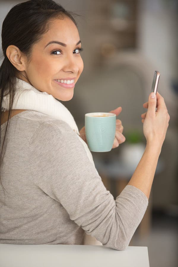 Relaxed Lady Having Coffee and Using Smartphone Stock Photo - Image of ...