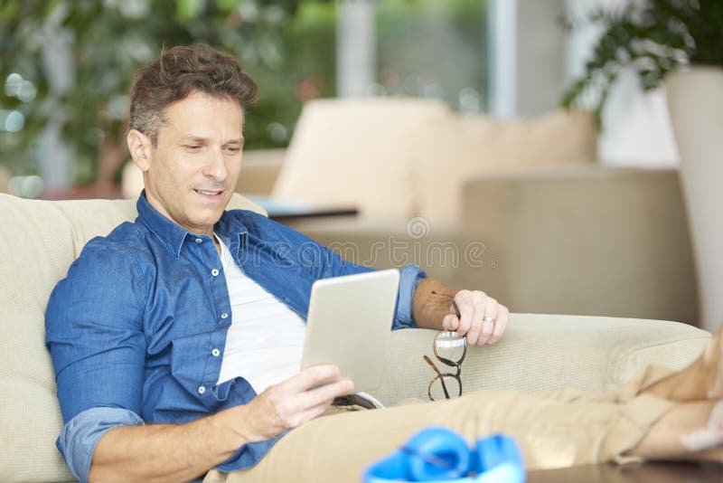 Relaxed Man with Digital Tablet Stock Photo - Image of people, happy ...