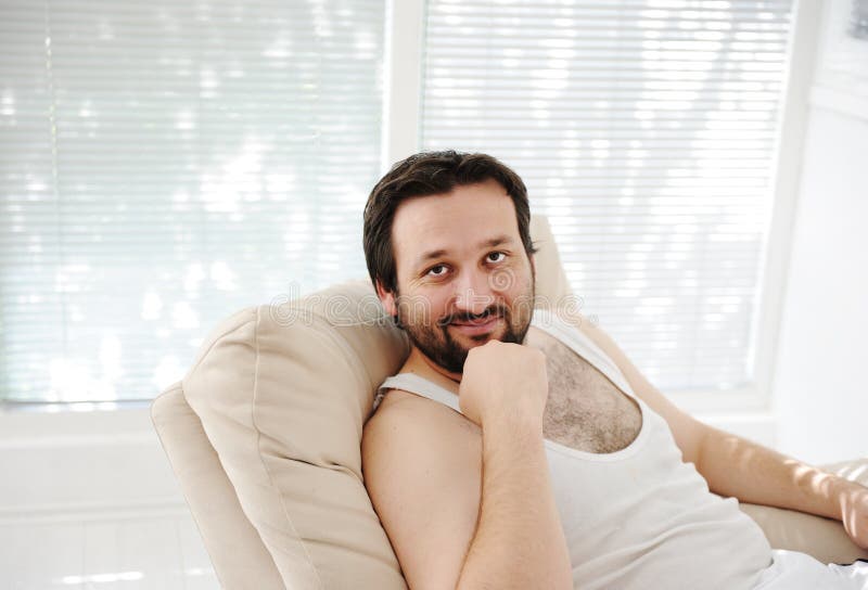 Relaxed man at home stock photo. Image of sitting, portrait - 22277390